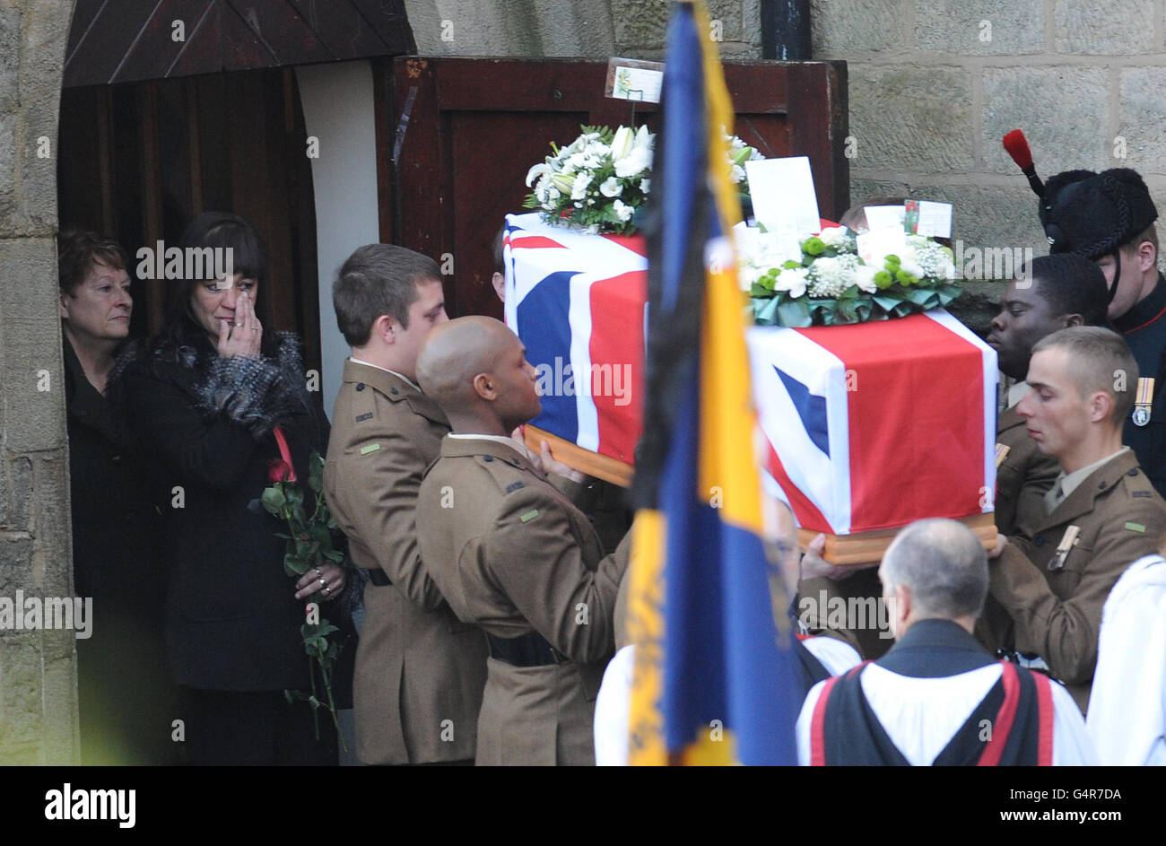The coffin of Rifleman Sheldon Steel is followed by his family led by ...