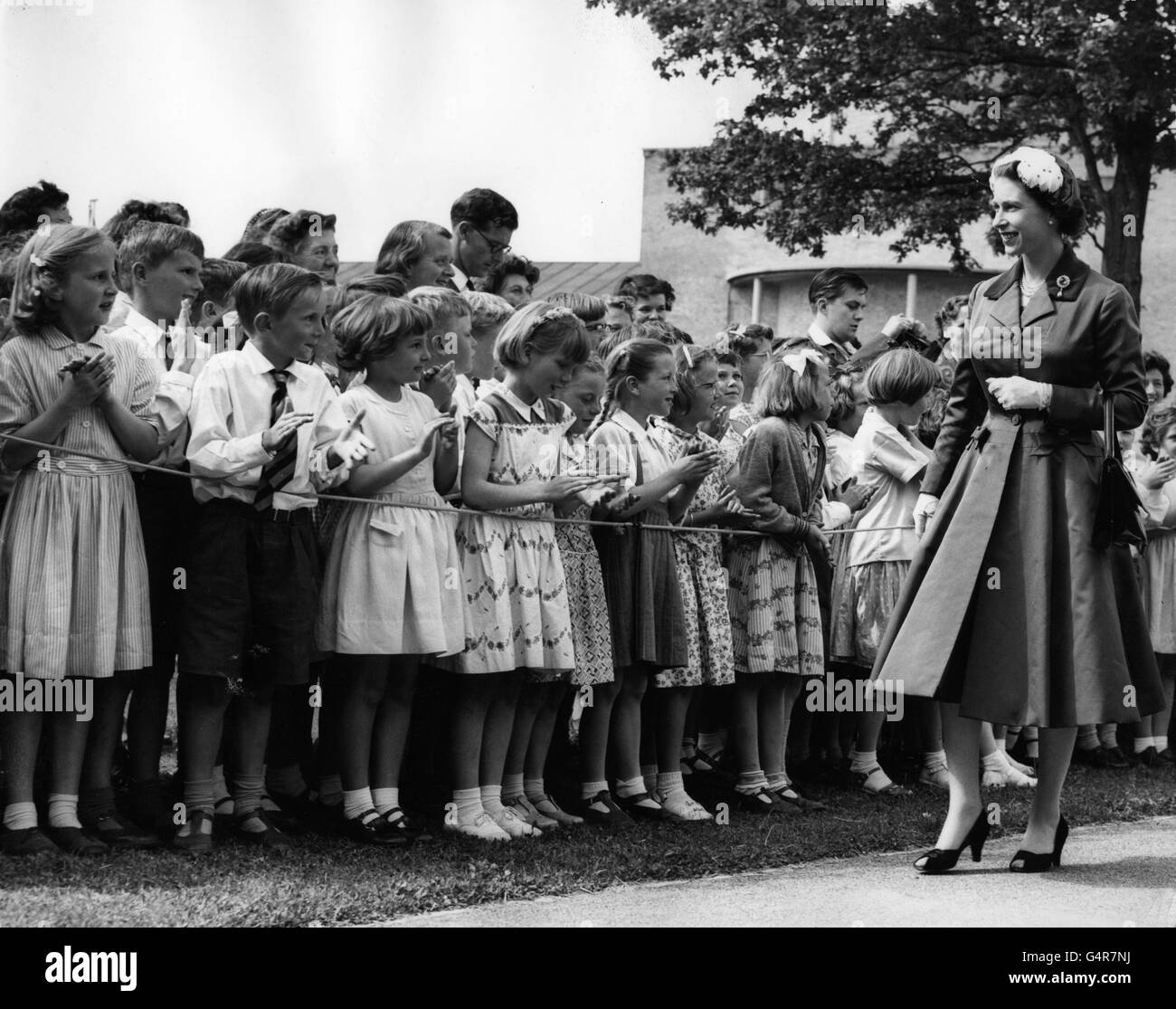 Queen Elizabeth II meeting schoolchildren at Three Bridges County ...