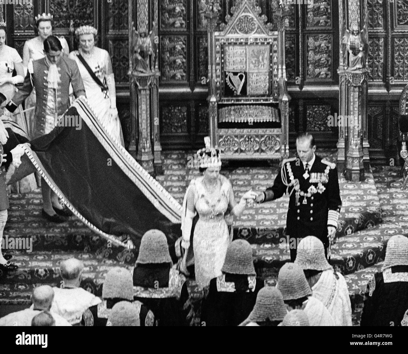 Queen Elizabeth II stepping down from the Throne on the hand of the ...