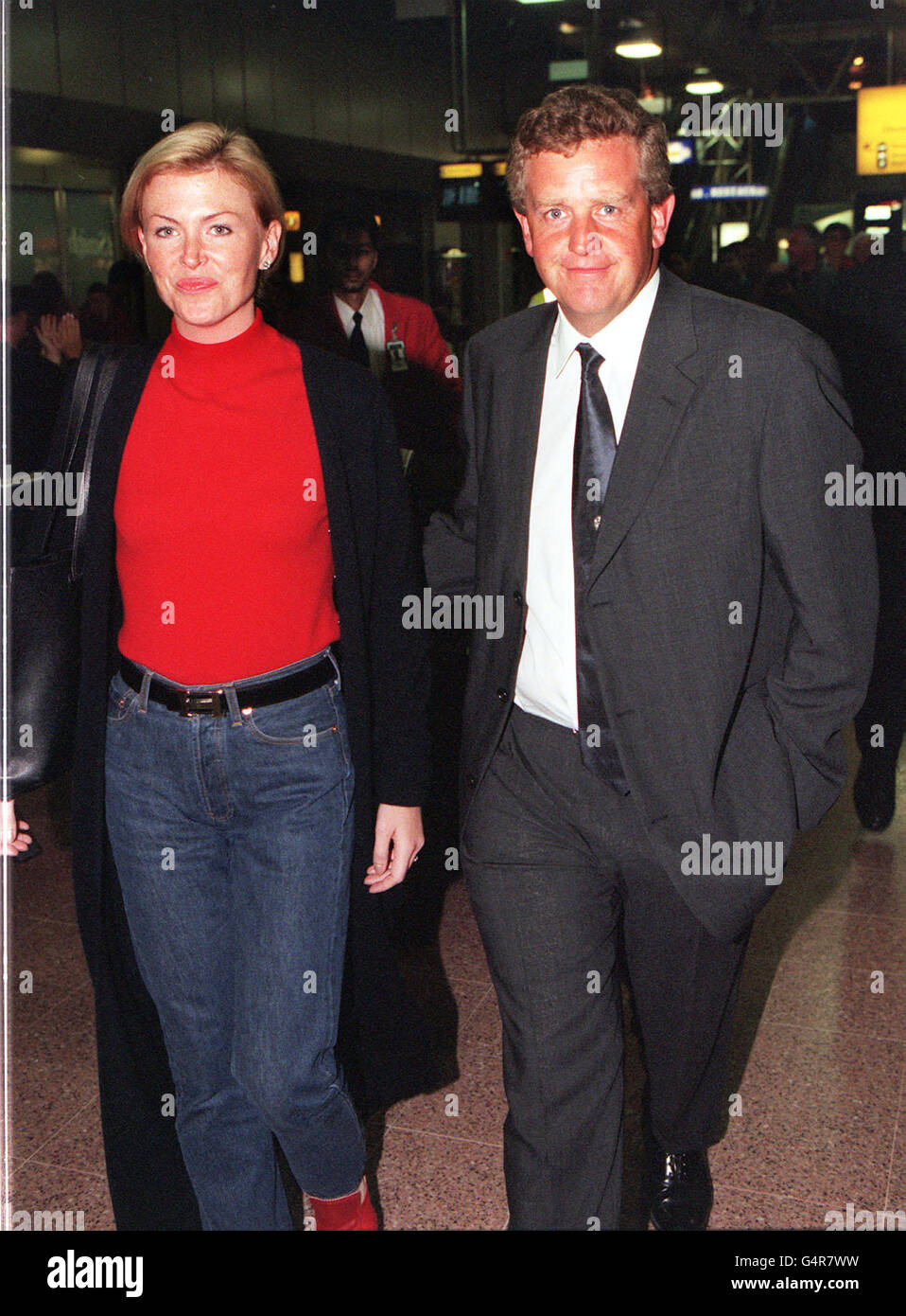Golfer colin montgomerie wife elmear arrive london heathrow airport hi ...