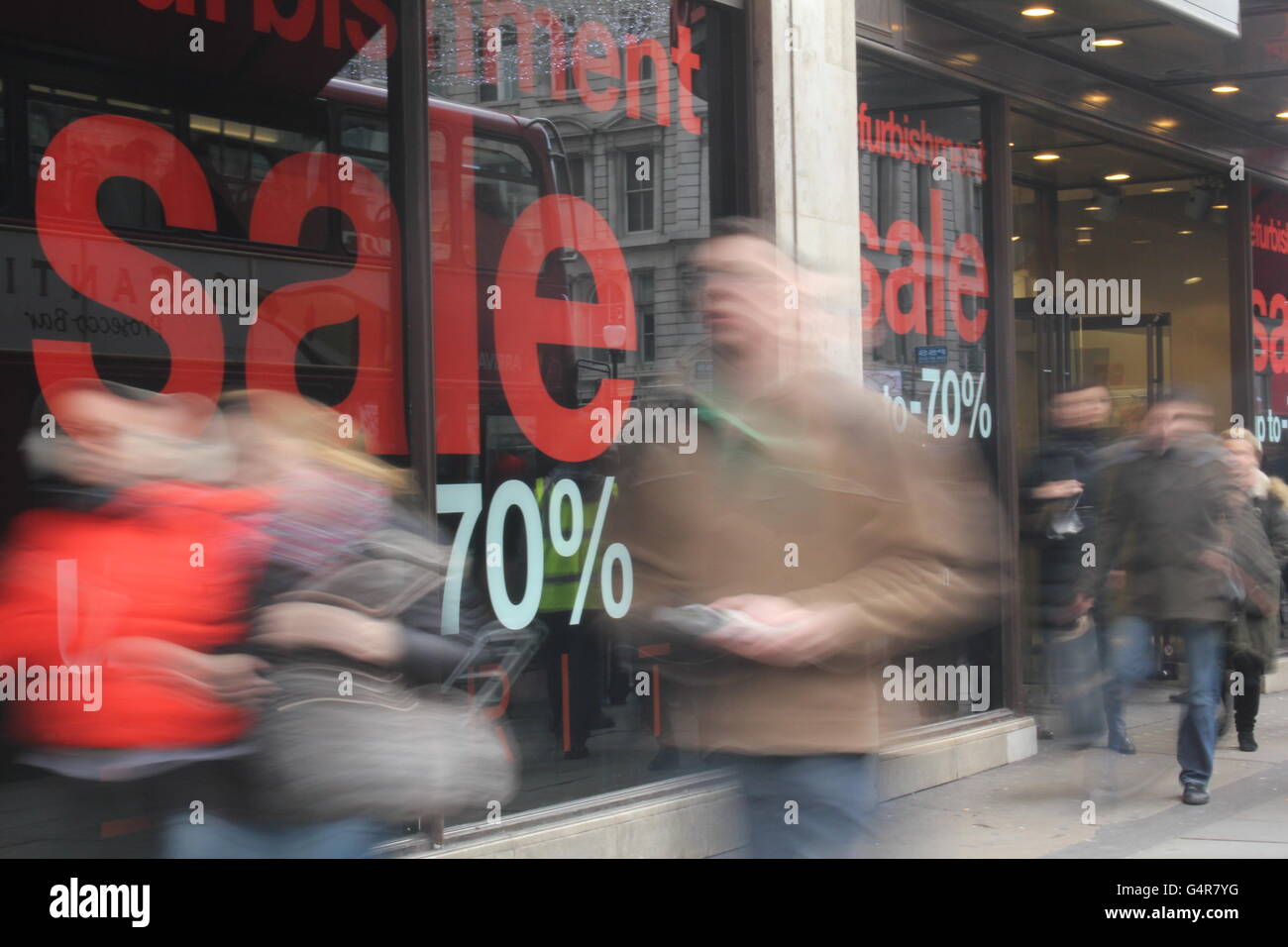 Pedestrians walk past a retail store on Regent Street, London Stock ...