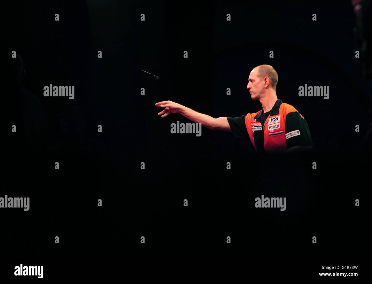 Holland's Roland Scholten in action against Great Britain's Jamie Caven ...