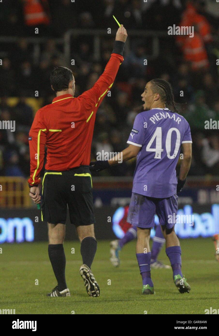 Tottenham Hotspurs Steven Pienaar is given a yellow card during the ...