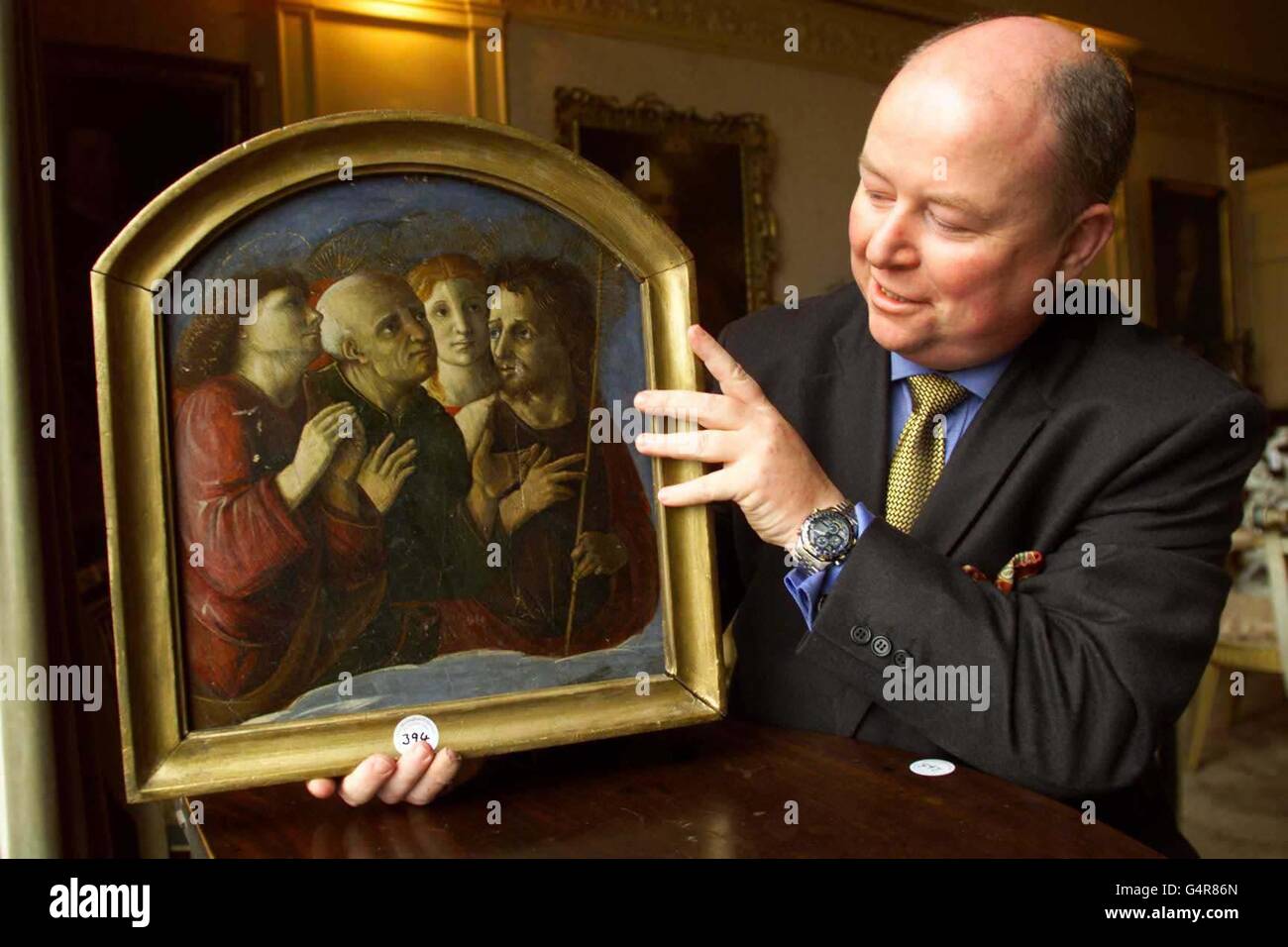 Auctioneer George Mealy, with an 15th century painting of Pietro de ...