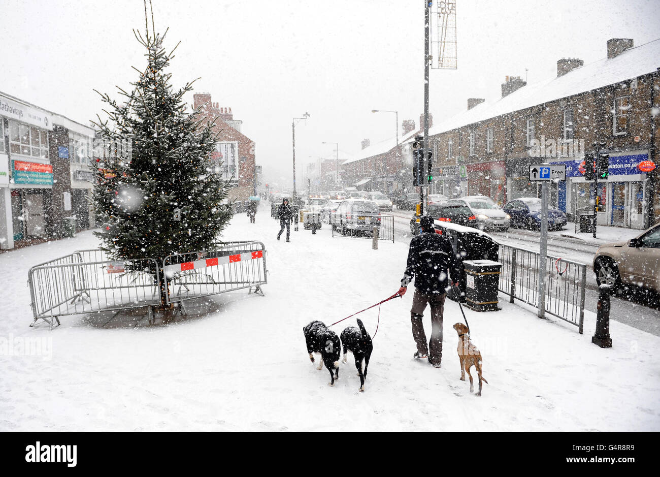 People walk through snow in Main Street, Gateshead, as parts of Britain ...