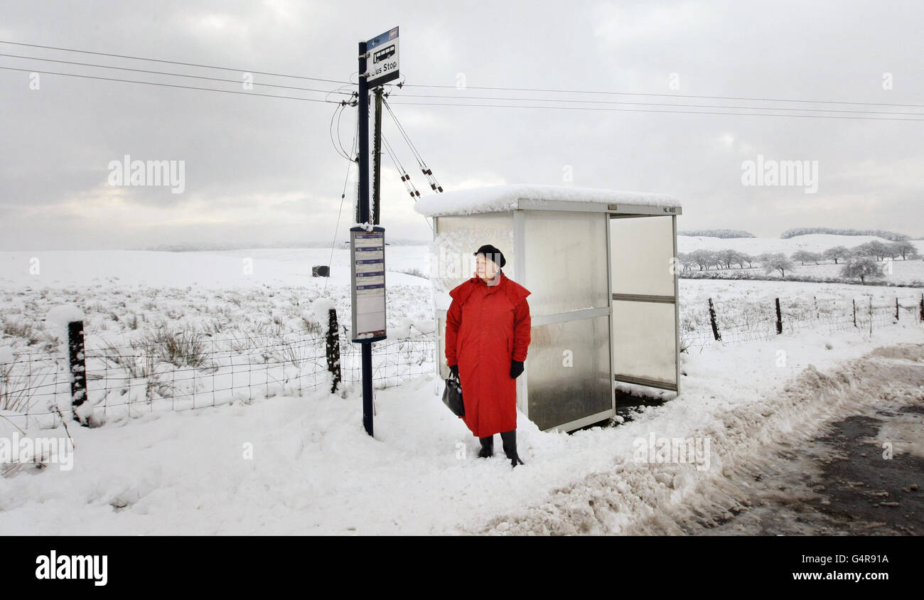 Ann Gibson waits for a bus in Hurst, near Whitburn in Scotland, ahead ...