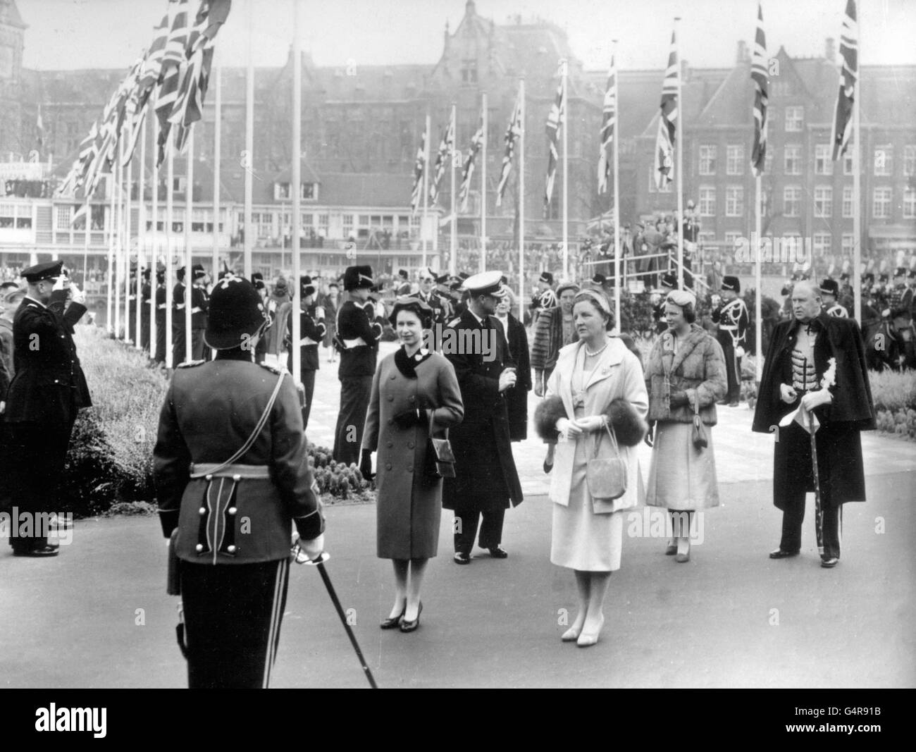 Queen Elizabeth II and the Duke of Edinburgh walk from the landing ...