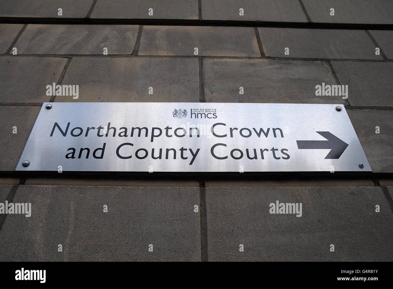A sign pointing the way to Northampton Crown and County Courts building ...