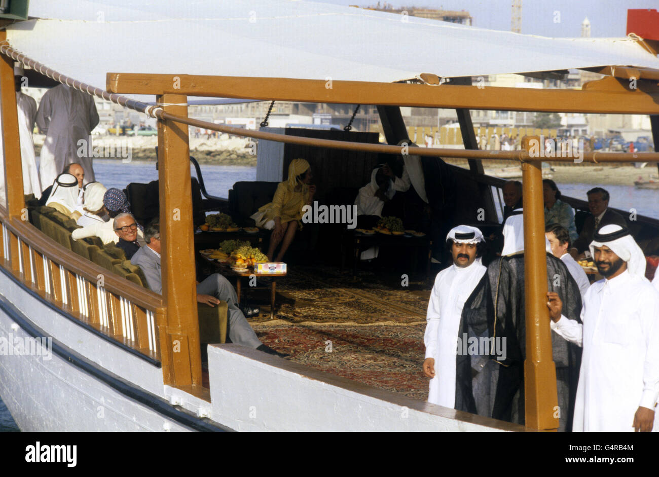 Queen Elizabeth II aboard an Arab dhow during her trip up Dubai Creek ...