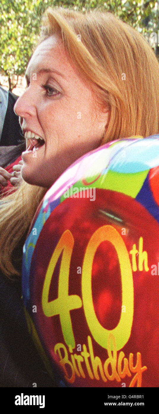 Sarah, the Duchess of York, with a balloon given to her by a well ...