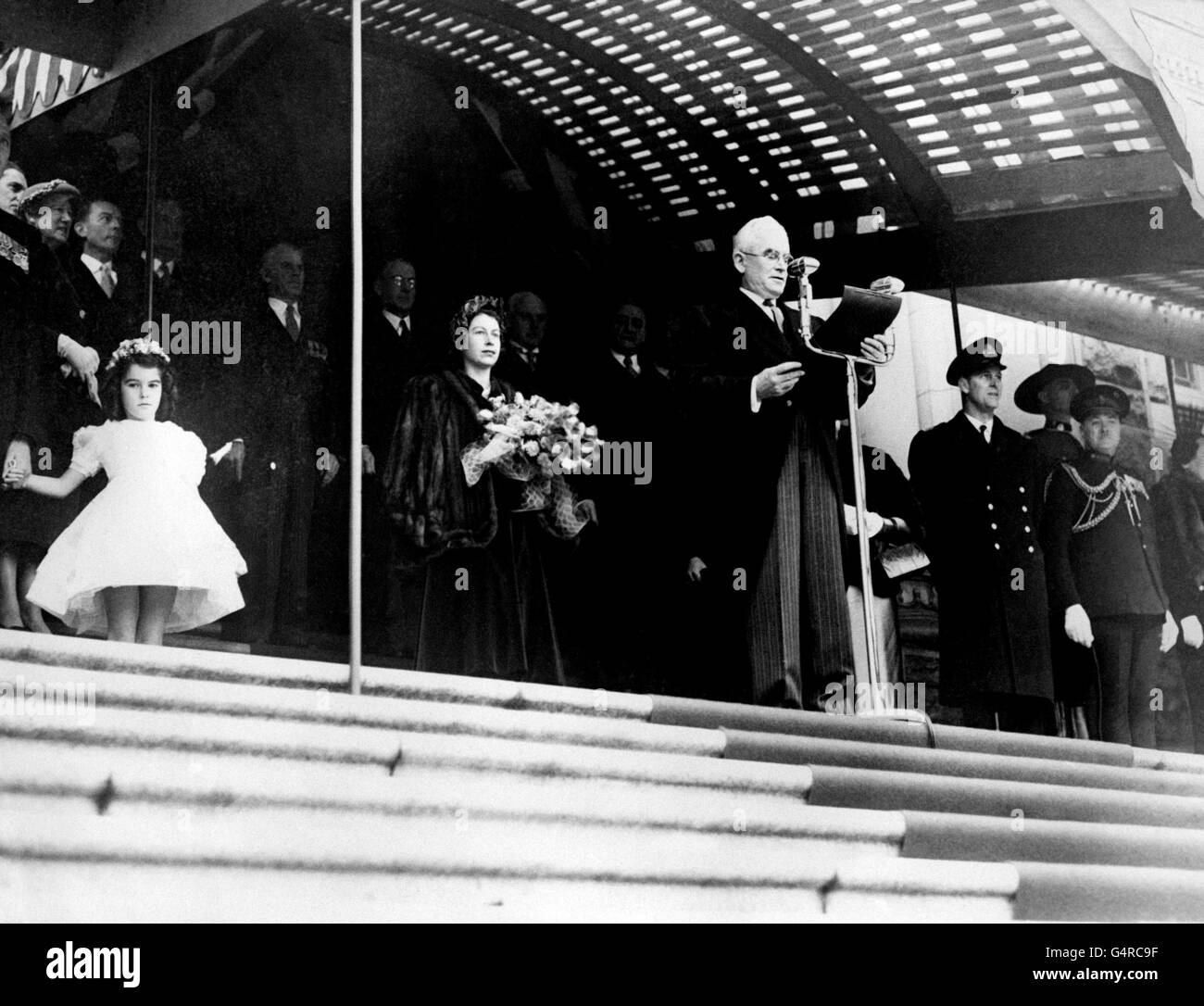 Princess Elizabeth and the Duke of Edinburgh (right) hear an address of ...