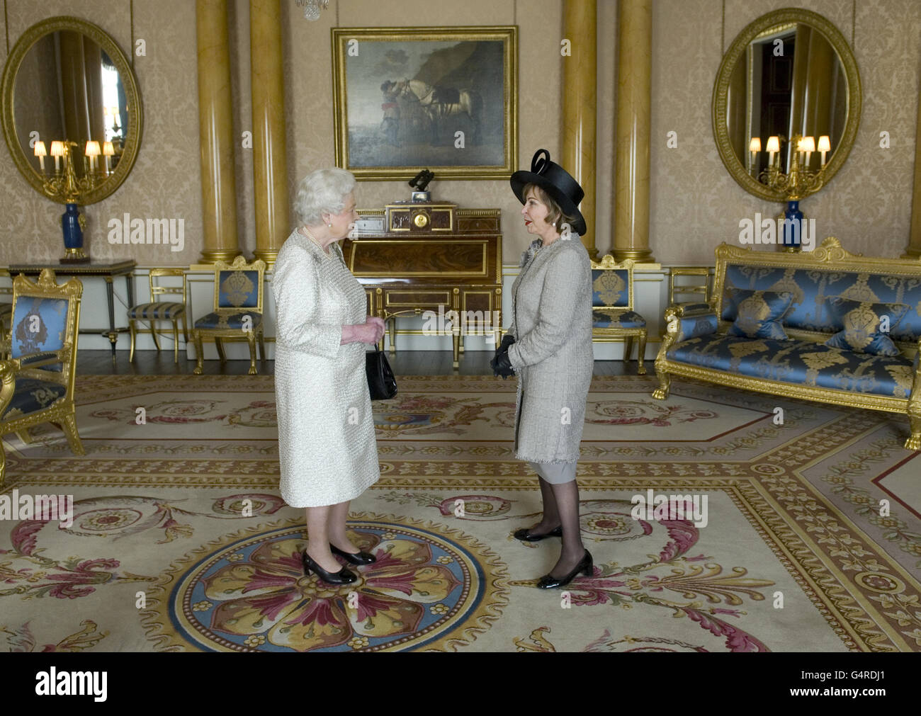 Britain's Queen Elizabeth II greets the Ambassador of Bahrain Mrs Alice ...