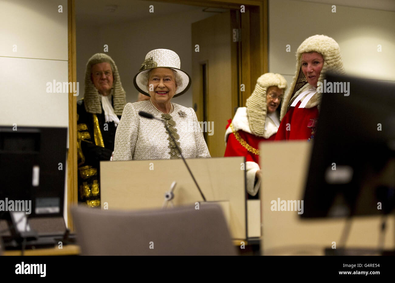 Queen Elizabeth II is shown the courtroom by Justice Gloster (right ...