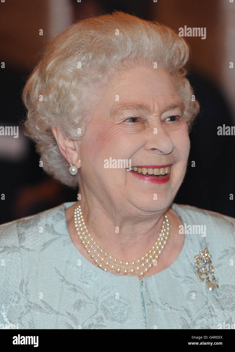 Queen Elizabeth II smiles as she and the Duke of Edinburgh host a ...