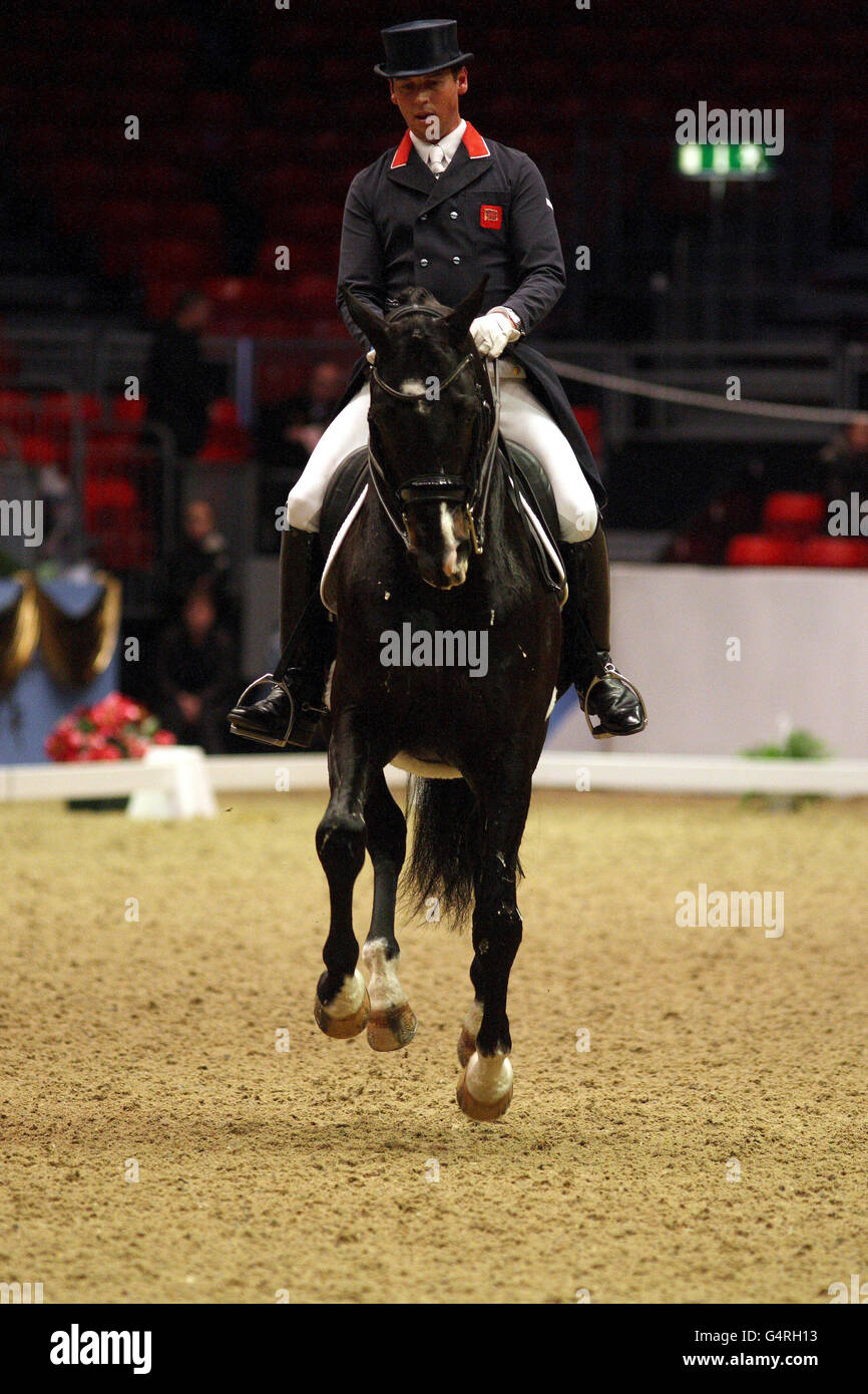 Great Britain's Carl Hester riding Uthopia competes in the Reem Acra ...