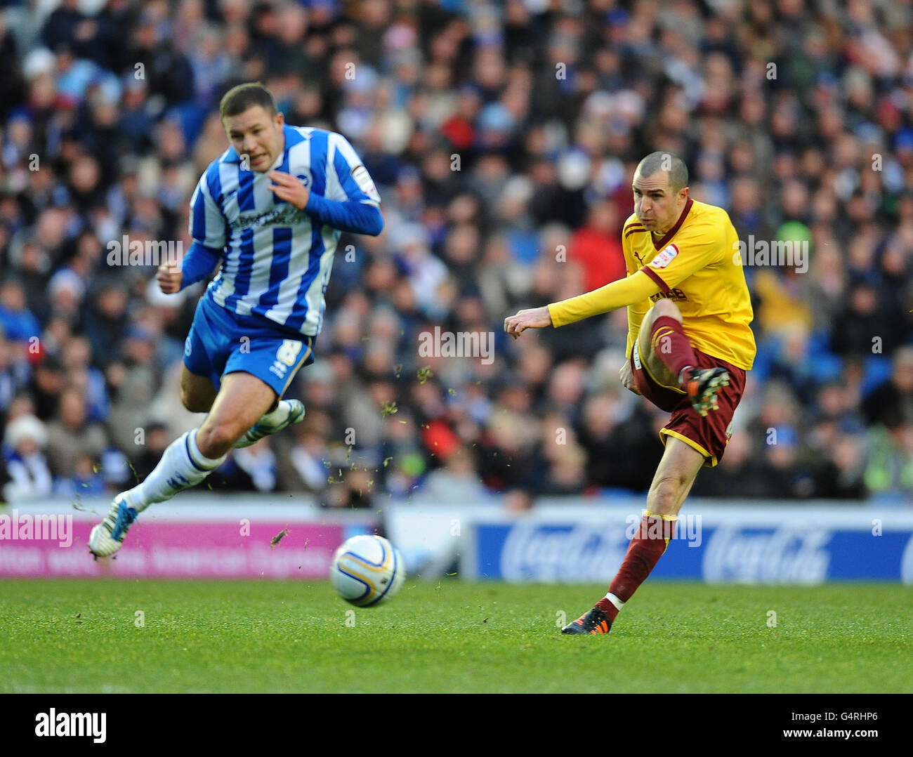 Burnley's Dean Marney shoots past Brighton & Hove Albion's Alan Navarro ...