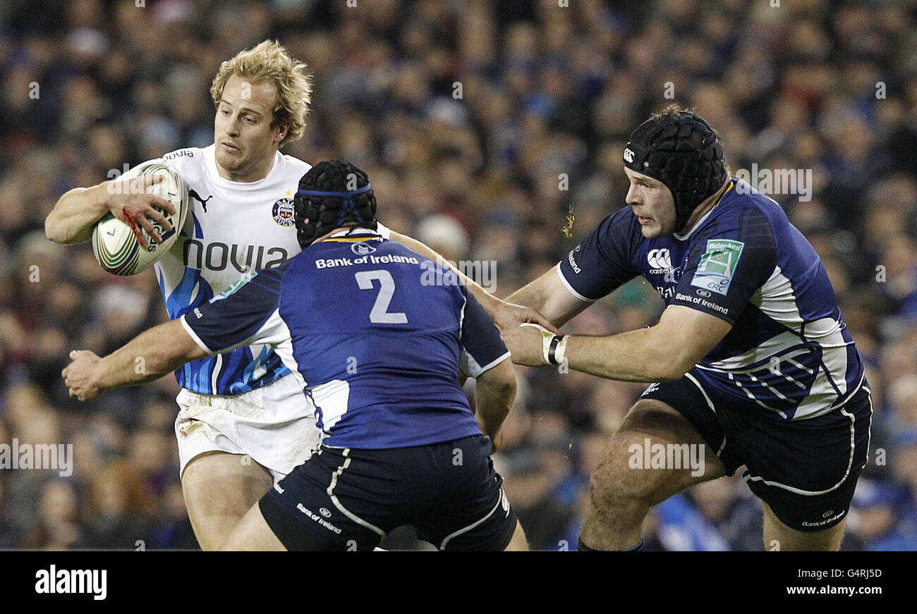Leinster's Richardt Strauss and Mike Ross tackle Bath's Nick Abendanon ...