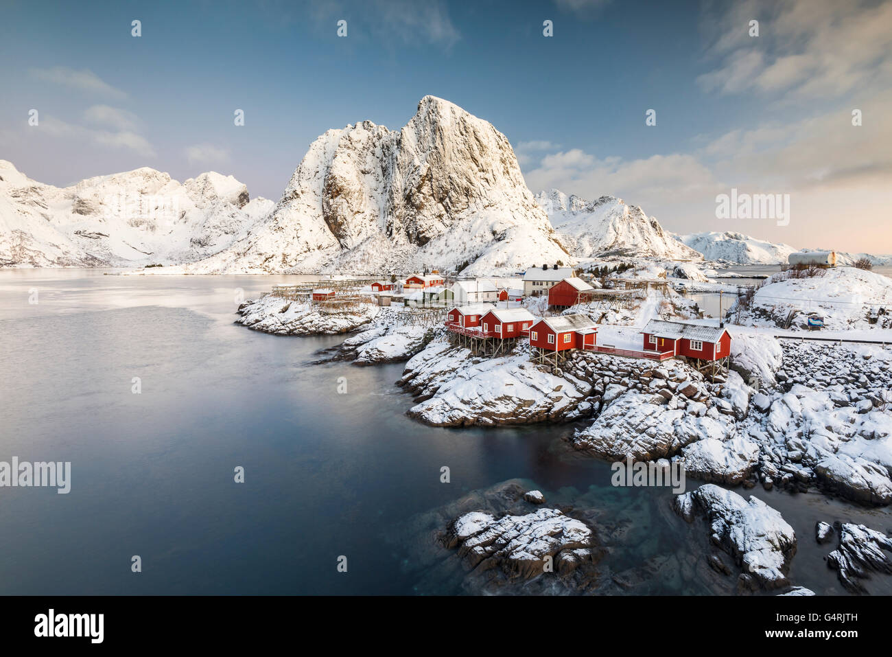 Town and fisherman's cabins or Rorbus in front of snowy mountains ...