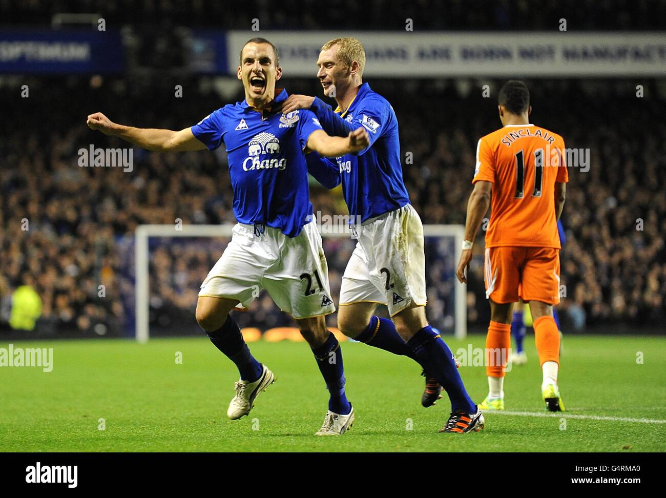 Everton's Leon Osman (left) celebrates scoring the opening goal of the ...