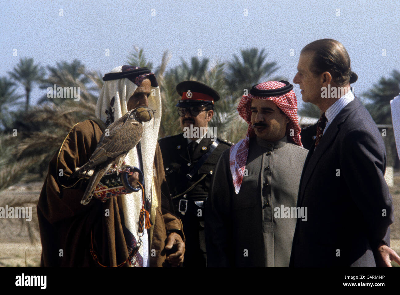 The Duke of Edinburgh, an experienced falconer, looking at one of the ...