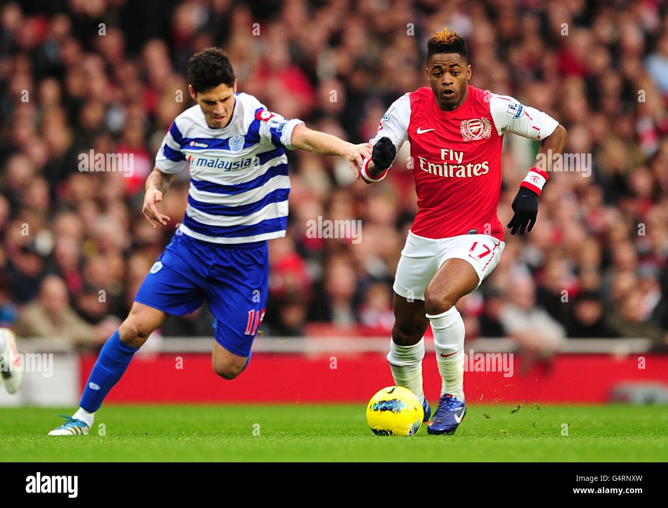 Arsenal's Alex Song and Queens Park Rangers' Alejandro Faurlin (left ...