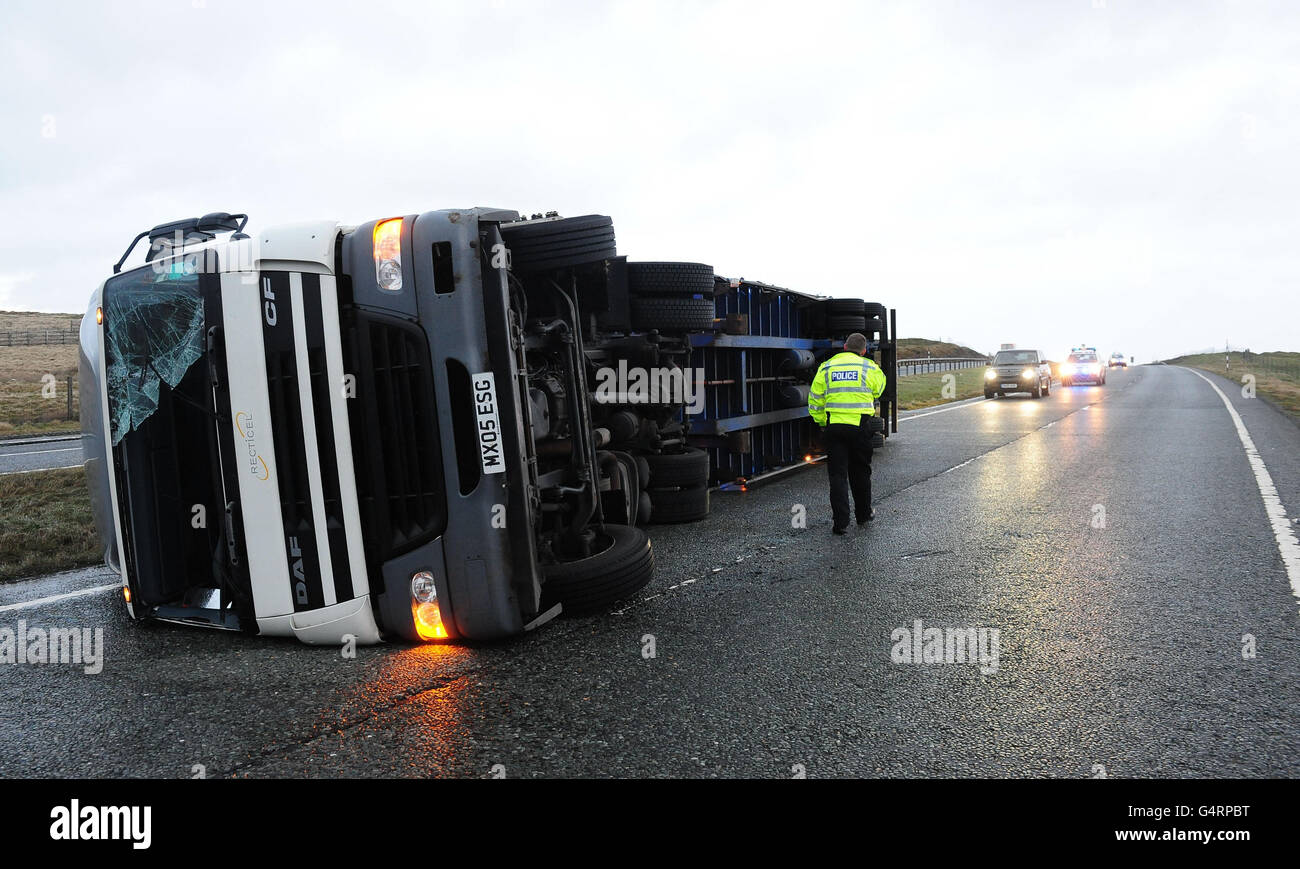 A Lorry Lies On Its Side After Being Blown Over In High Winds On The
