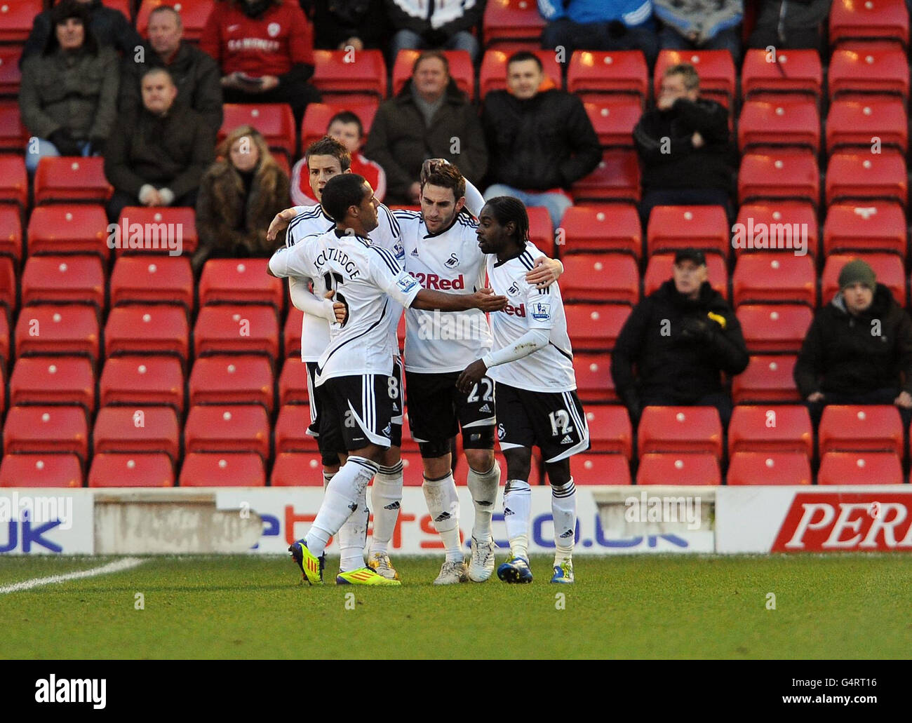 Swansea City's Angel Rangel (second right) celebrates after scoring his ...