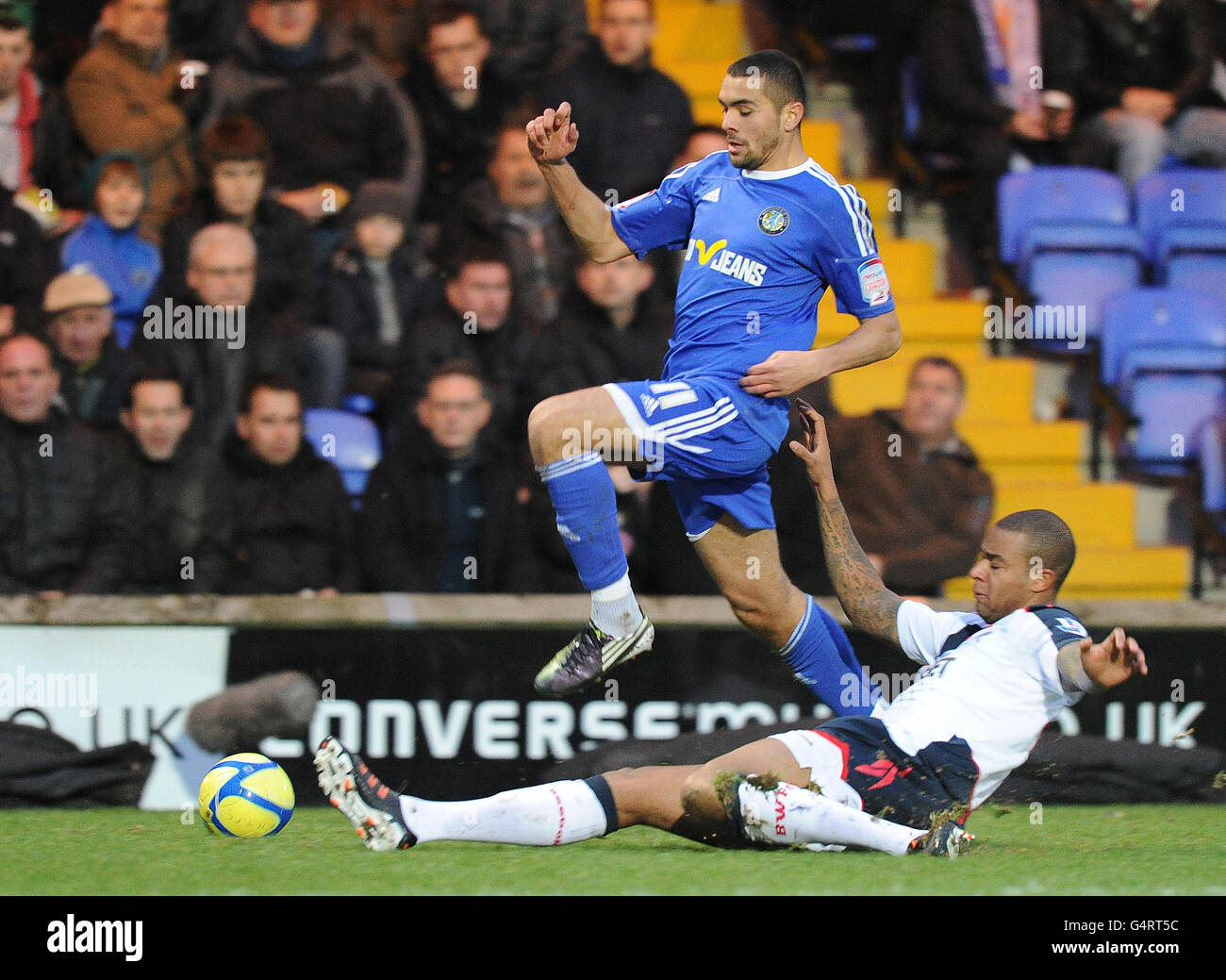 Macclesfield Town's Colin Daniel skips past Bolton Wanderers Zat Knight ...