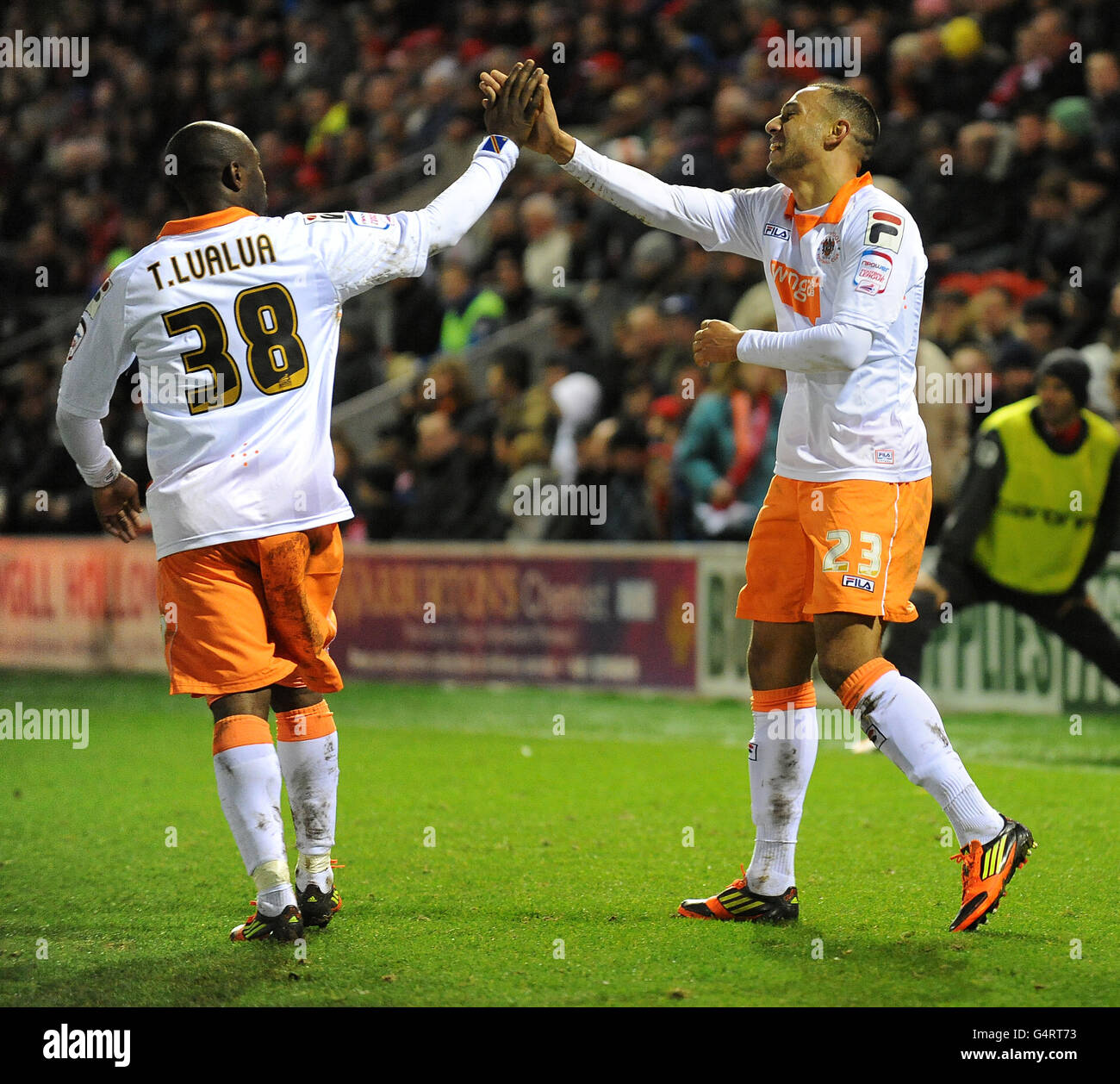 Blackpool's Matt Phillips (right) celebrates with Lomana Tresor Lua Lua ...