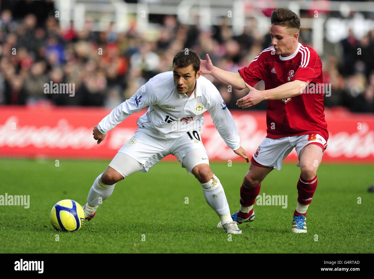 Swindon Town's Simon Ferry and Wigan Athletic's Shaun Maloney battle ...