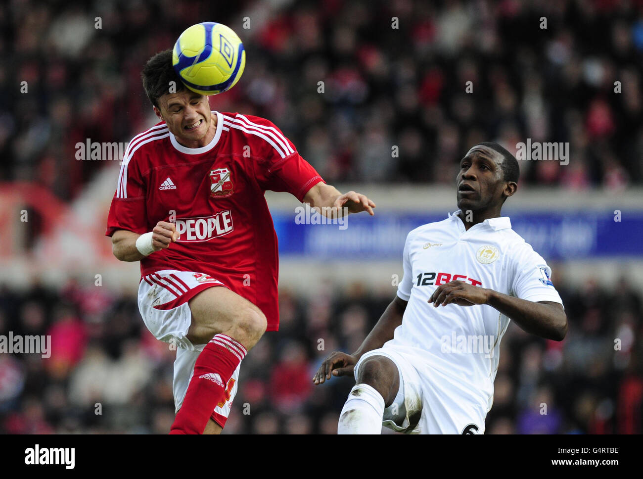 Swindon Town's Jonathan Smith and Wigan's Hendry Watson during the FA ...
