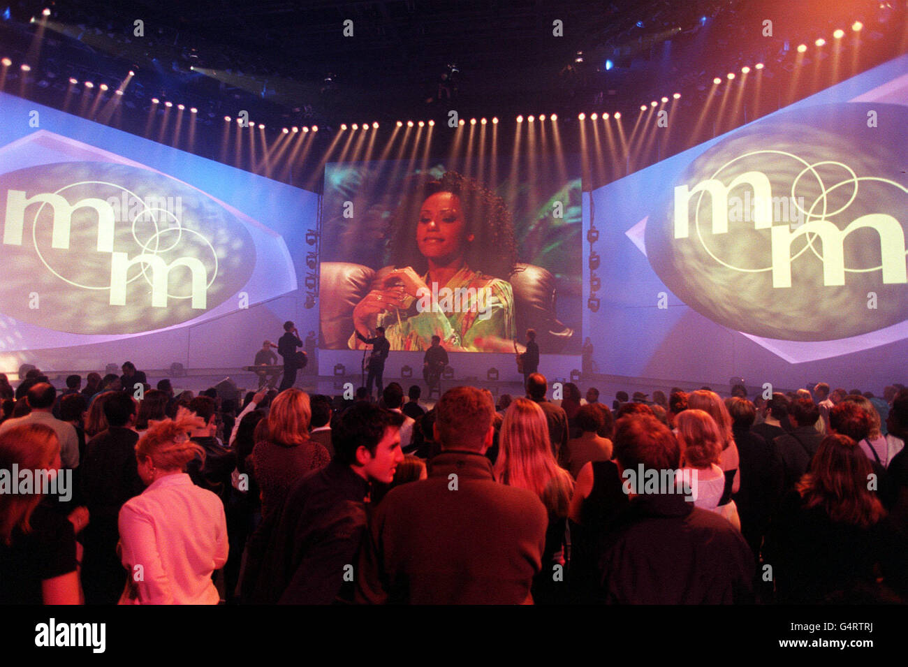 Mel G from the girl band the Spice Girls is watched by an audience from ...