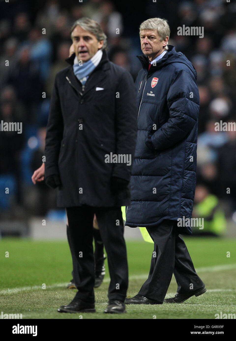 Manchester City's manager Roberto Mancini and Arsenal's manager Arsene ...