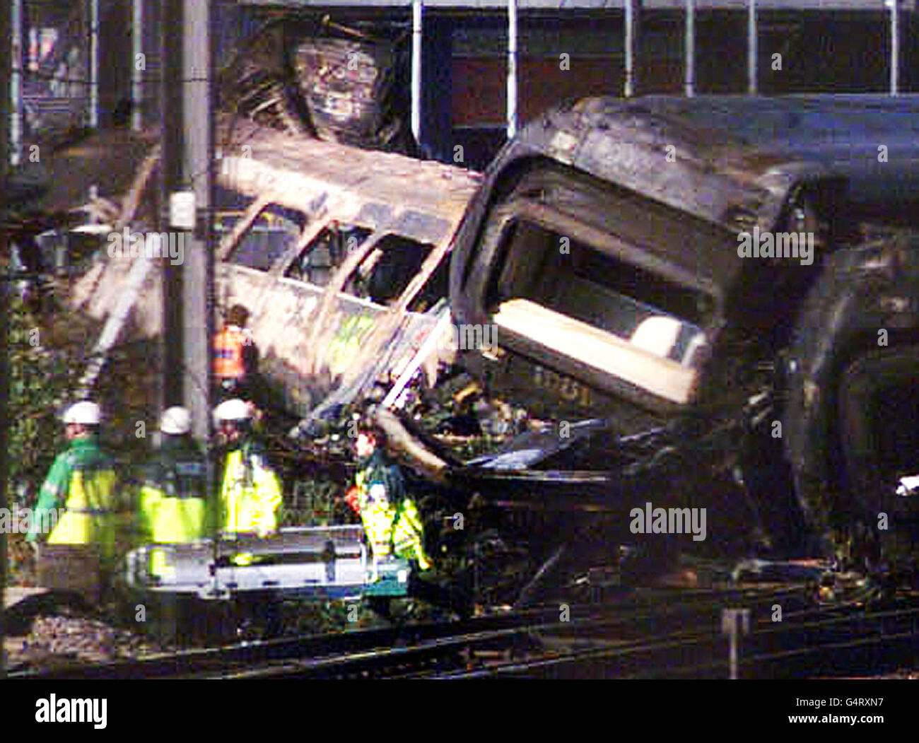 The wreckage of two trains lie on rails in west London after a crash. A ...