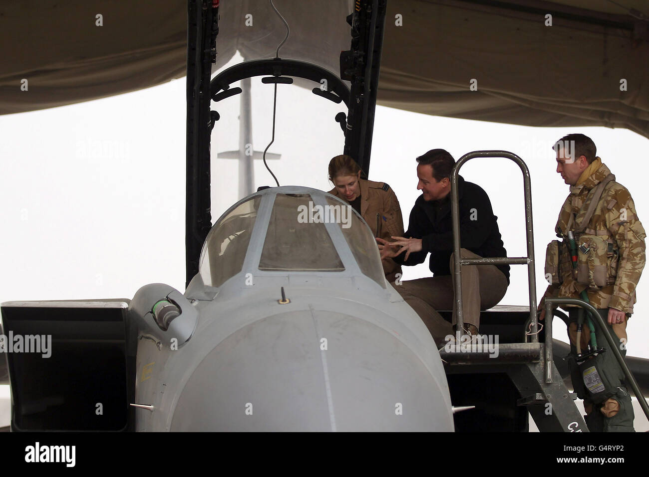 Prime Minister David Cameron views the cockpit of a Tornado fighter ...