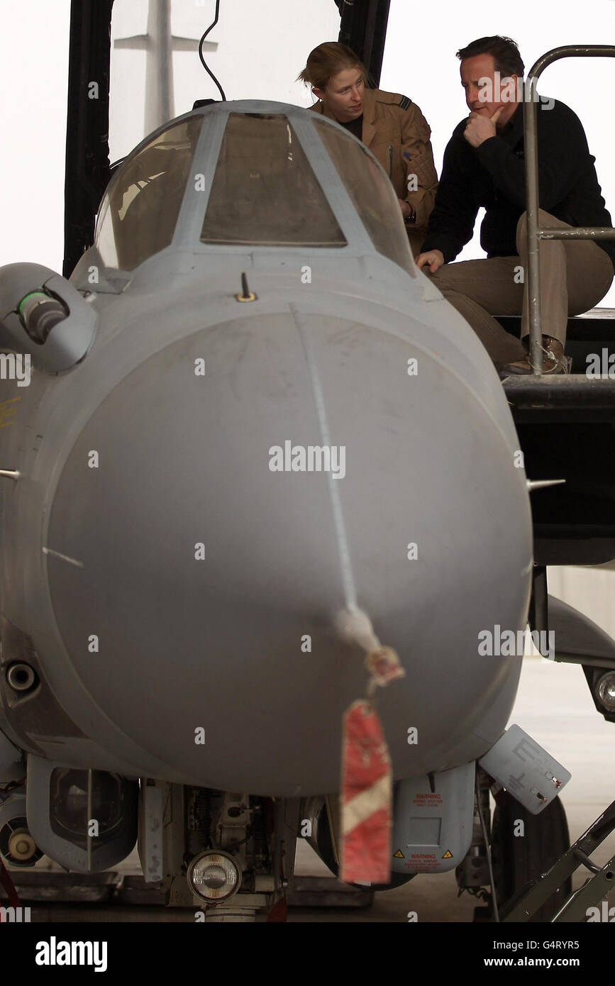 Prime Minister David Cameron views the cockpit of a Tornado fighter ...
