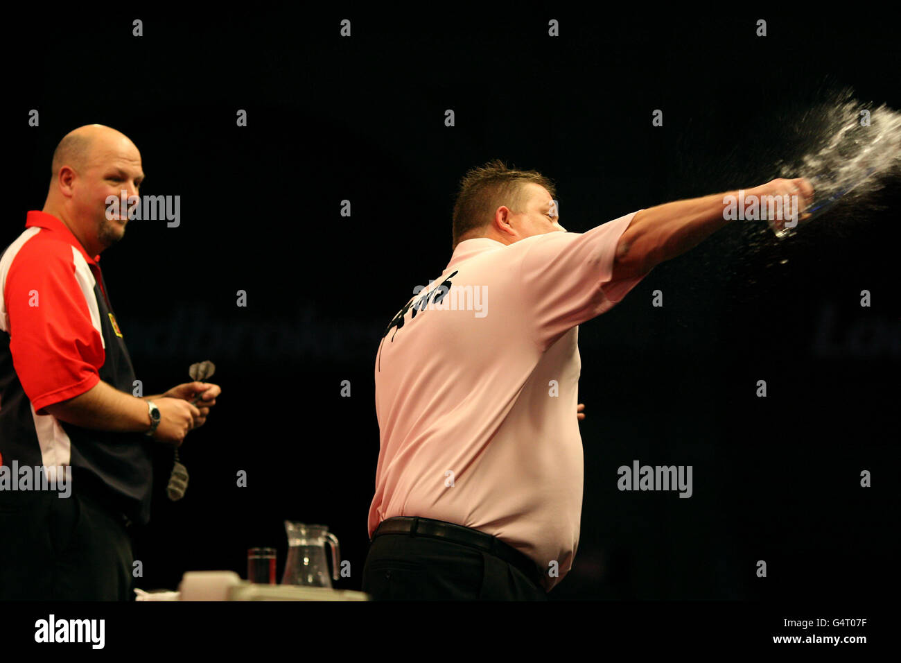 Colin Lloyd throws water into the crowd in celebration after defeating ...