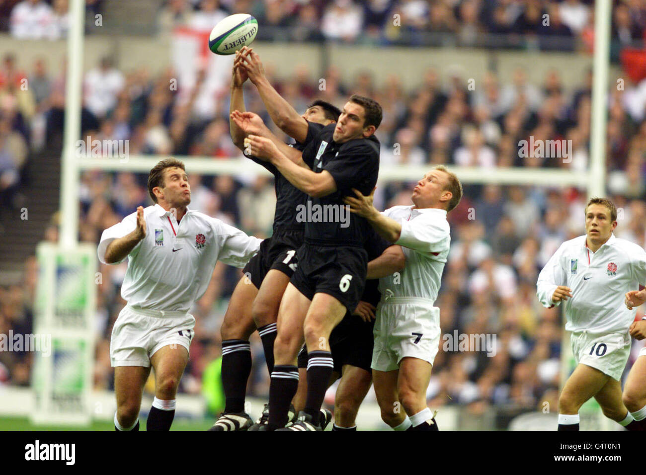Reuben Thorne of New Zealand rises above England players Phil de ...