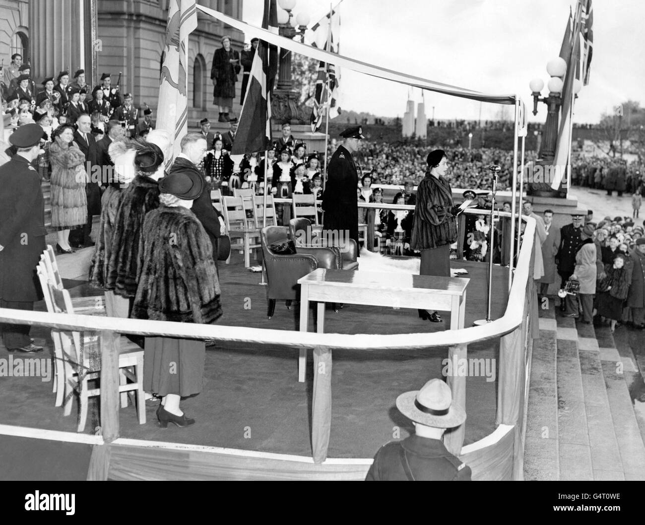 Princess Elizabeth, with the Duke of Edinburgh behind, at a civic ...