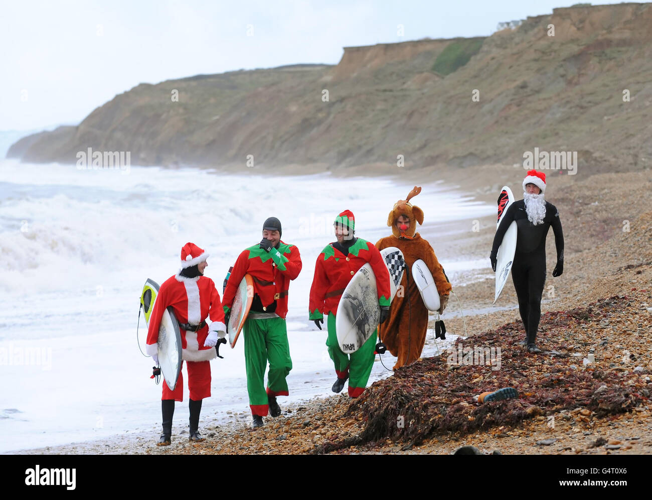 Surfers (left to right) Martin Drake-Knight, Oliver Harvey, Rob Drake ...