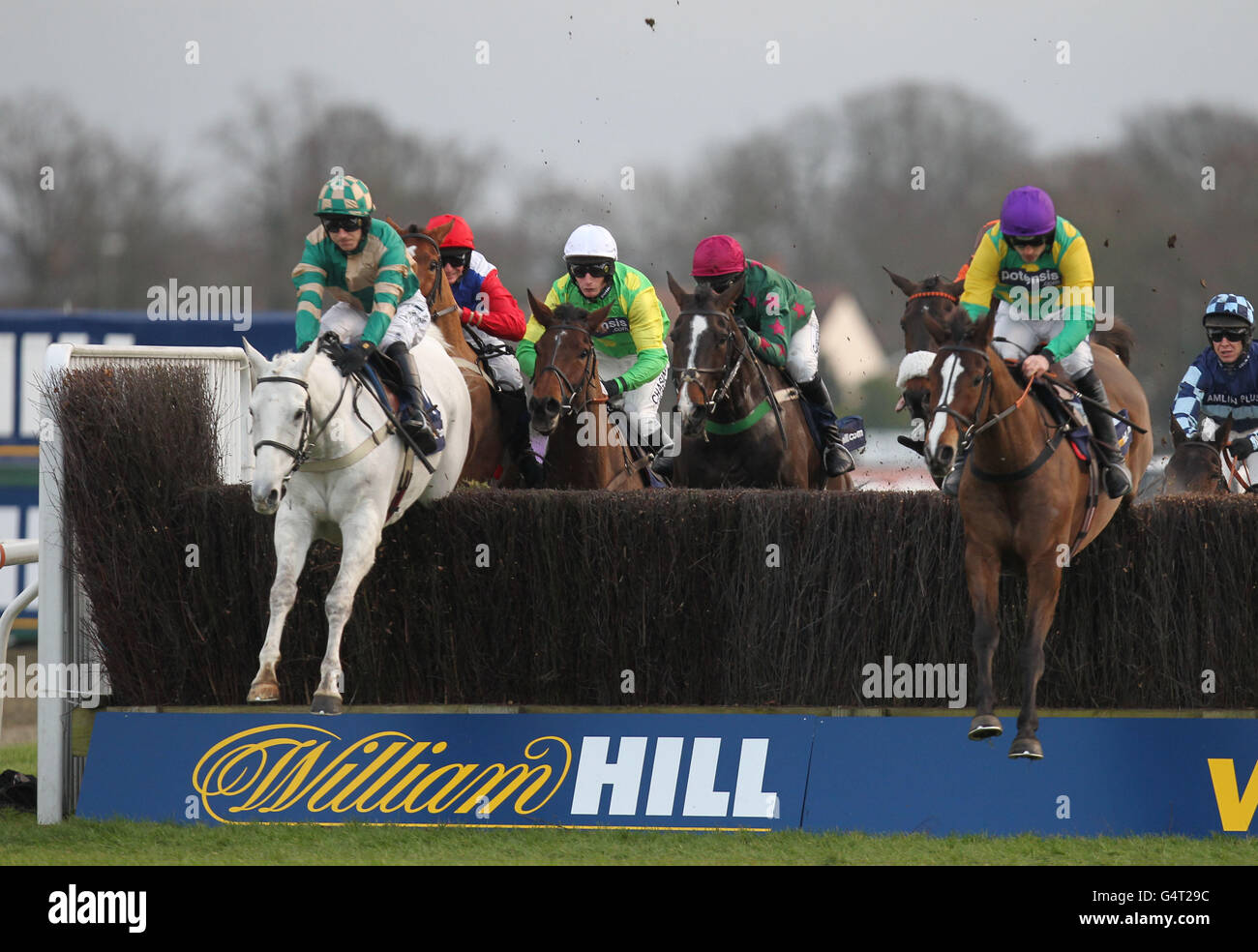 The horses jump the last fence on the 1st circuit, winner Kauto Star ...