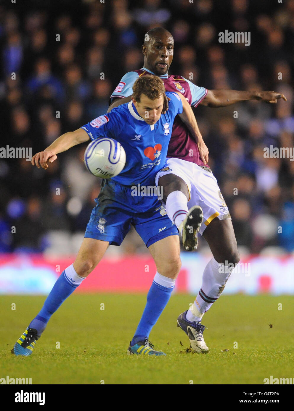 Birmingham City's Jonathan Spector and West Ham United's Carlton Cole ...