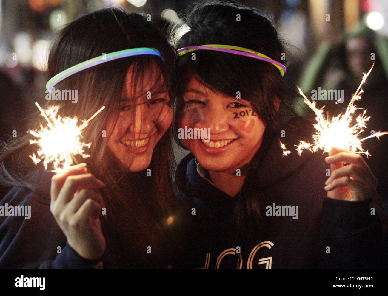 Jessica Ong from Singapore (right) and her sister Vanessa Ong start ...