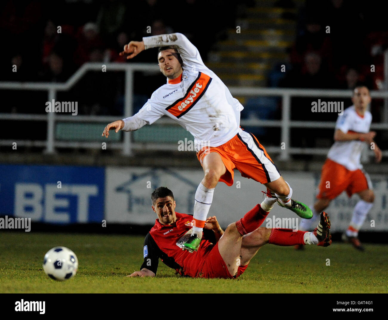 Kettering Town's Stephan O'Leary tackles Luton Town's Greg Taylor Stock ...