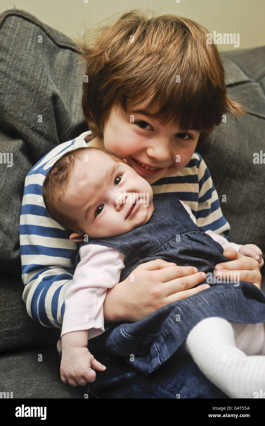 Twins born five years apart Stock Photo - Alamy