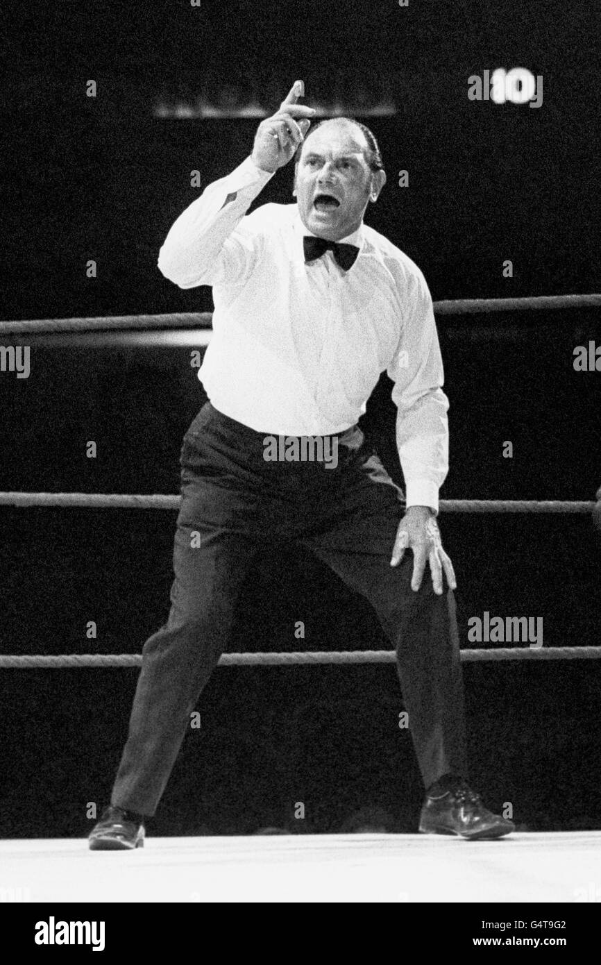 Referee harry gibbs gives joe bugner a count of nine, in the tenth ...