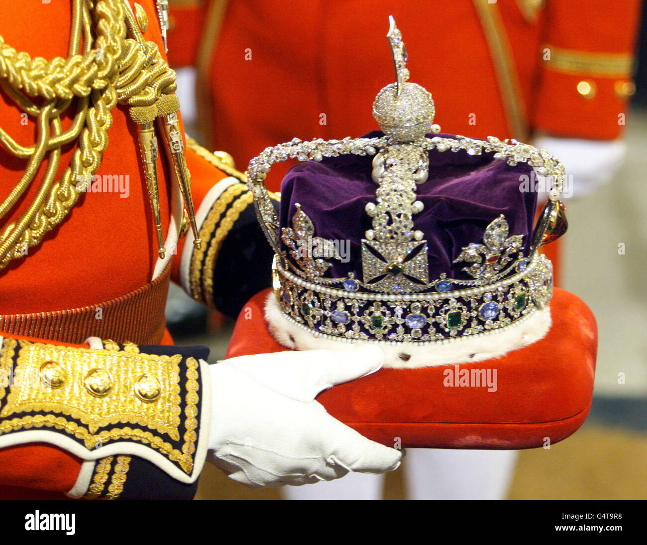 The Imperial State Crown is carried into Parliament through the ...