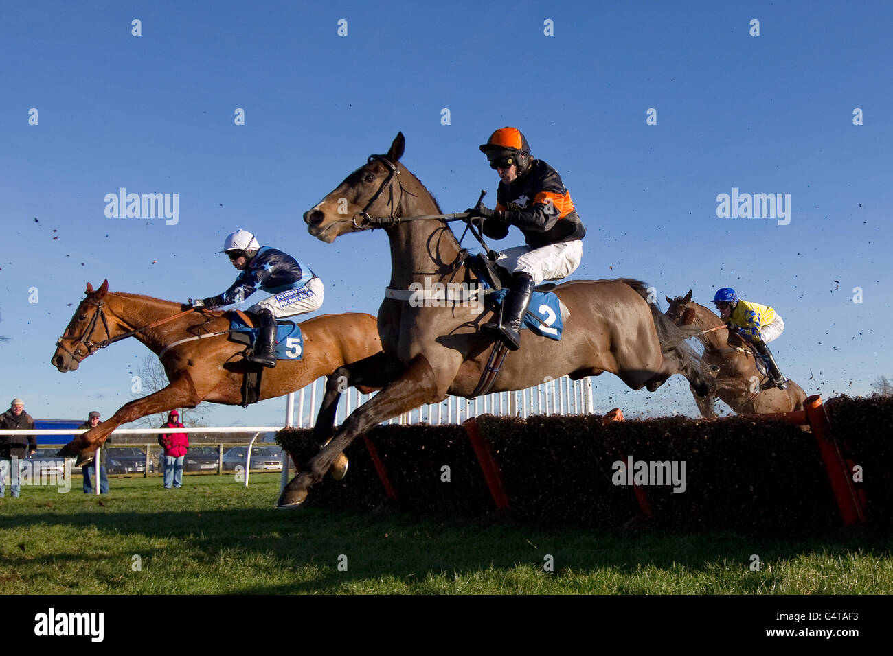 Goodness (left) ridden by Jockey Denis O'Regan jumps ahead of Coax ...