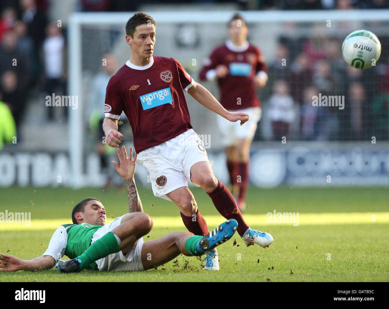 Hibernian's Victor Palsson tackles Hearts Ian Black during the ...