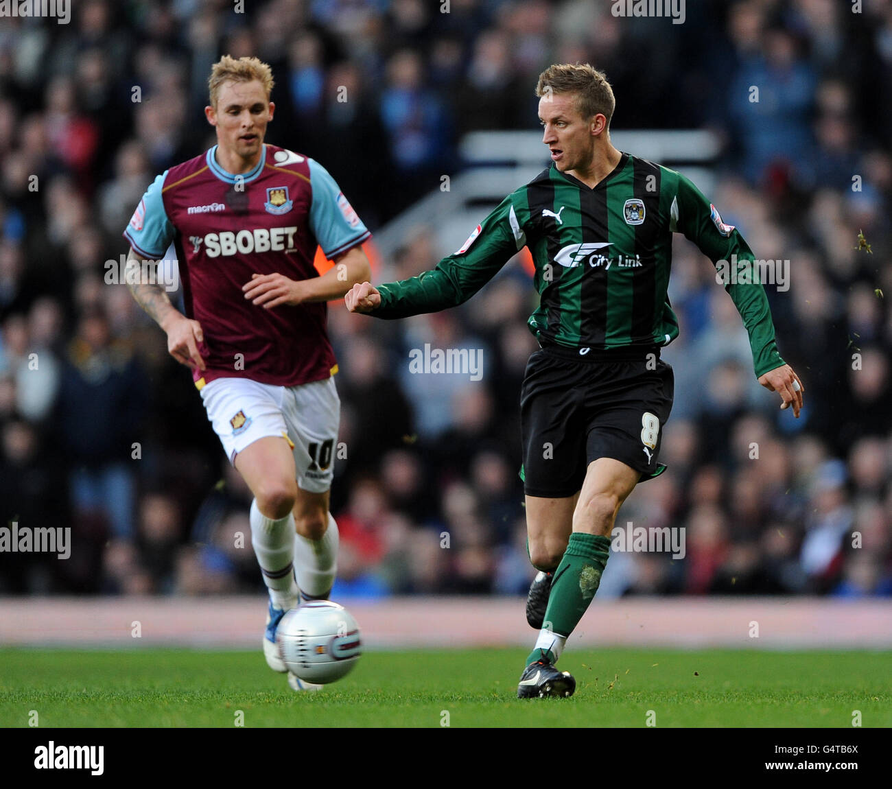 West Ham Utd's Jack Collison (left) and Coventry City's Carl Baker ...